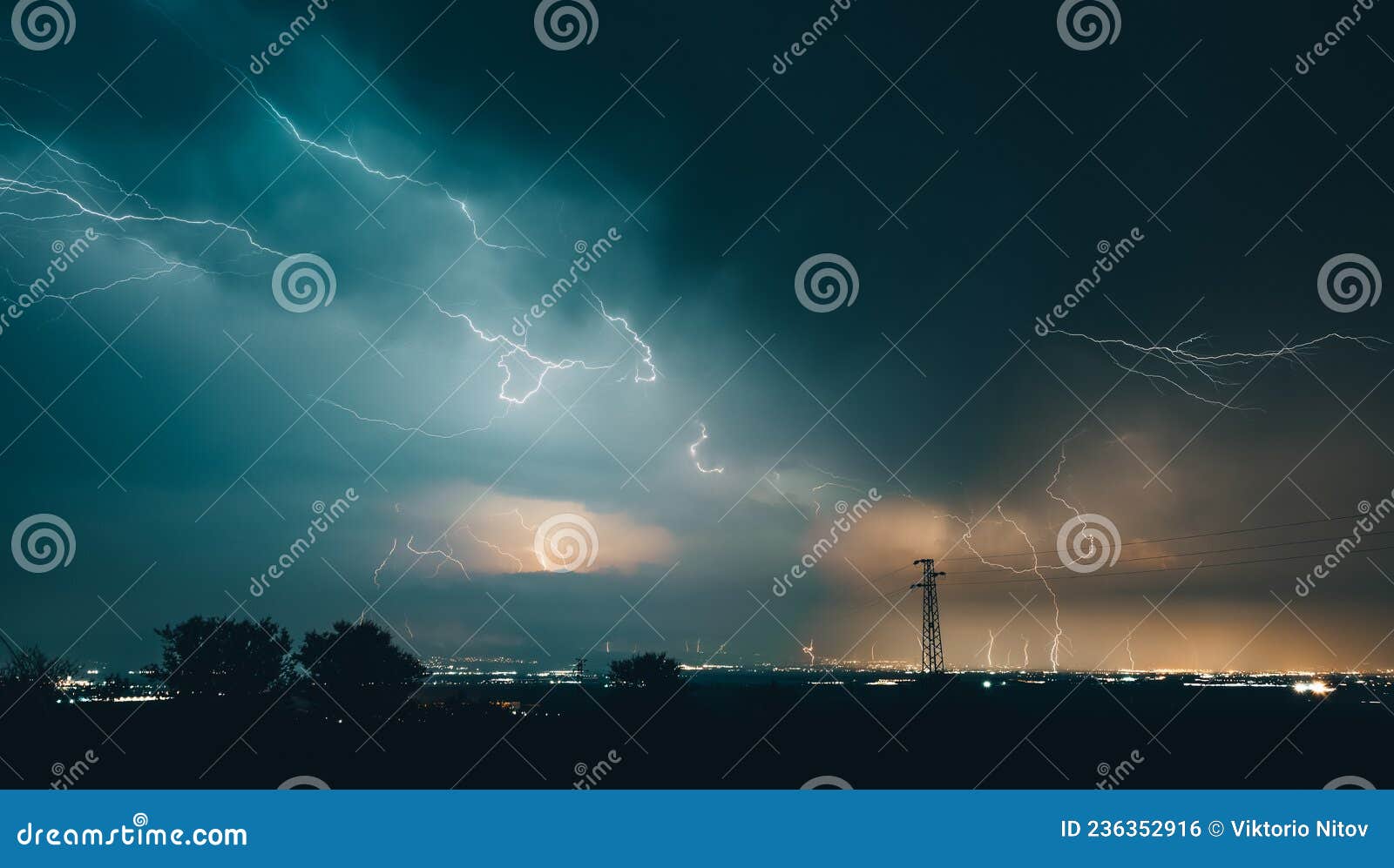 Long, Branched, Powerful Lightning Bolts Strike Down Behind the Trees ...