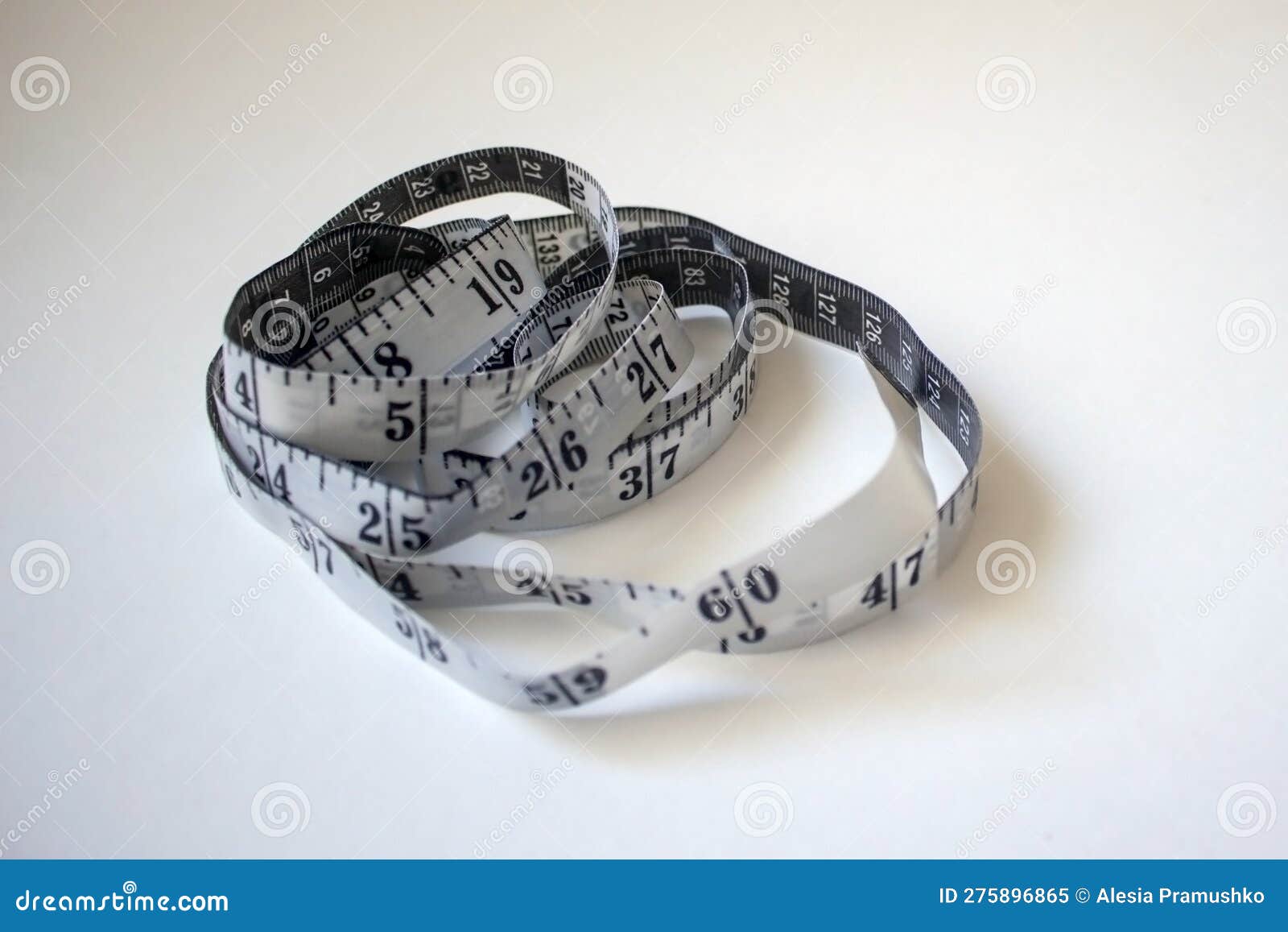 White Measuring Tape on a Bright Table Stock Image - Image of ...