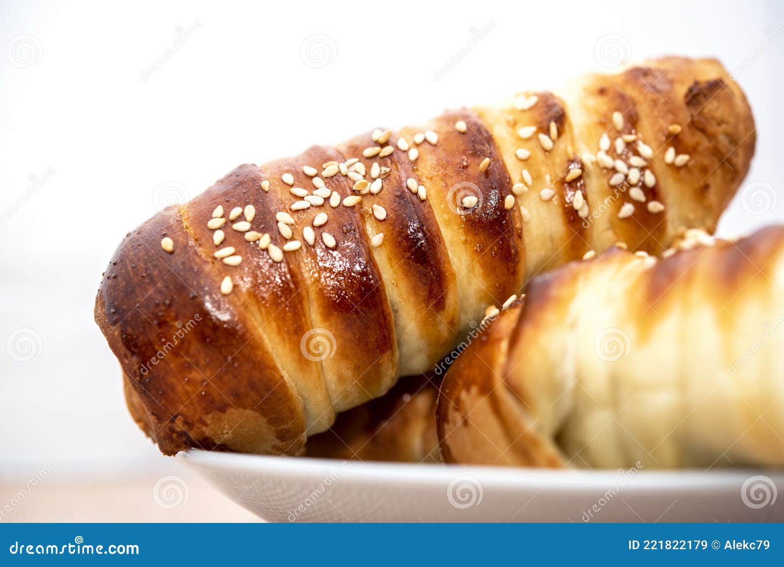 Long Bun with Sesame Seeds on a Plate Stock Image - Image of dinner ...