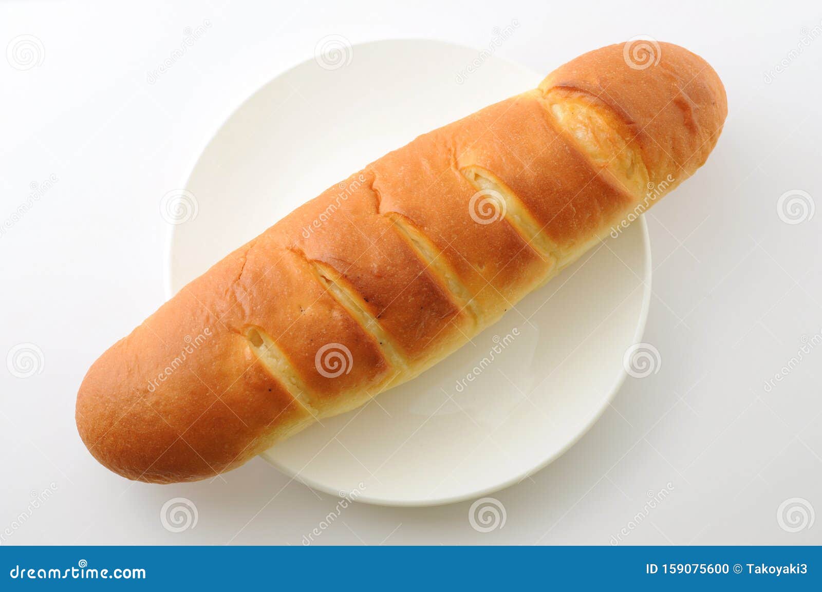 Long Butter Bread on Plate on White Background Stock Photo - Image of ...