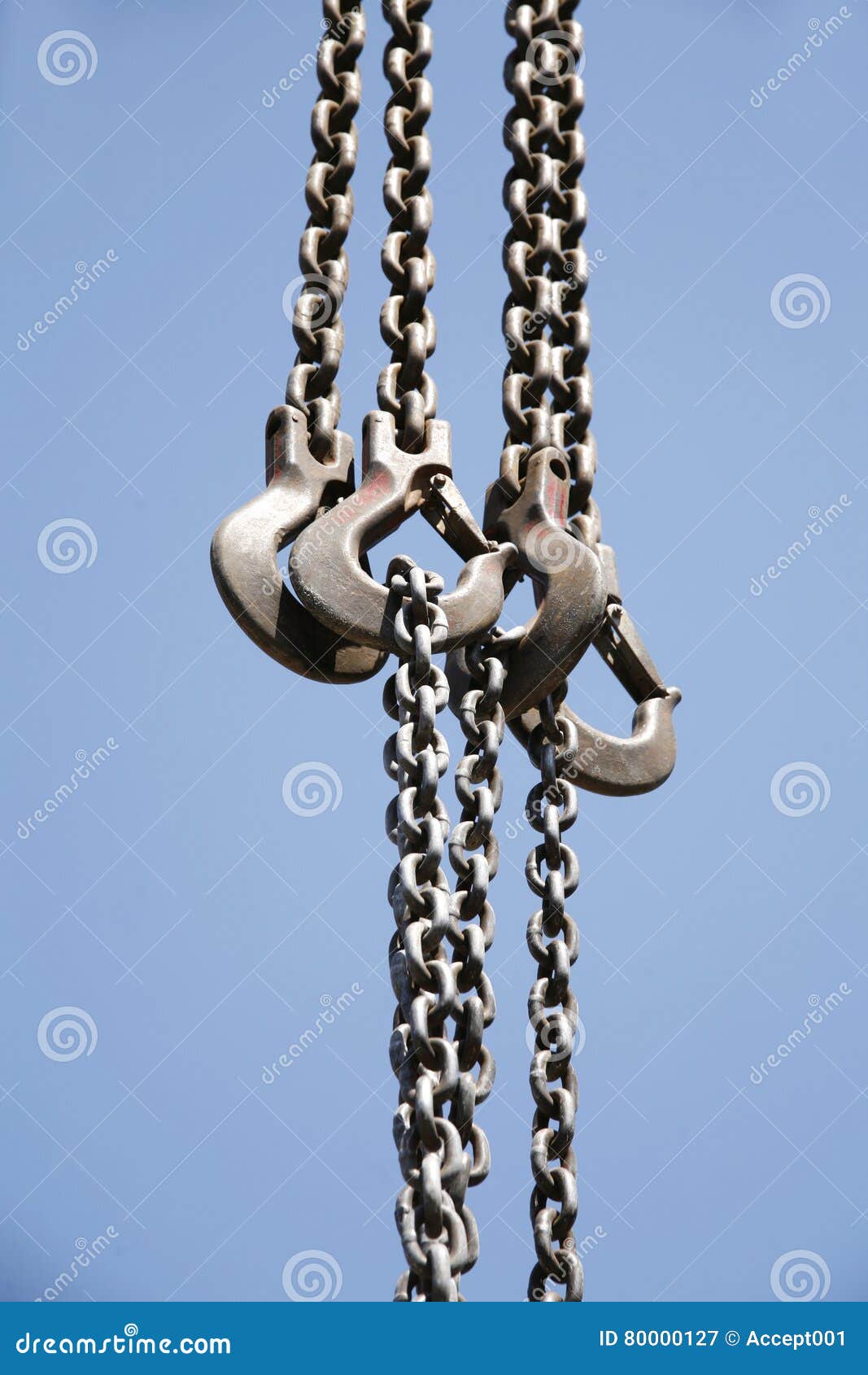 Long Chains with Hooks Hanging Vertically Against Blue Sky Stock Image ...