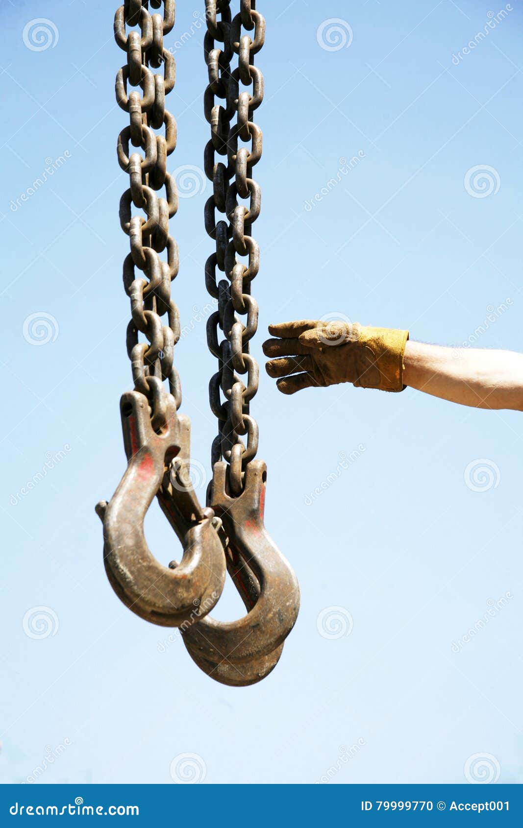 Long Chains with Hooks Hanging Vertically Against Blue Sky Stock Photo ...