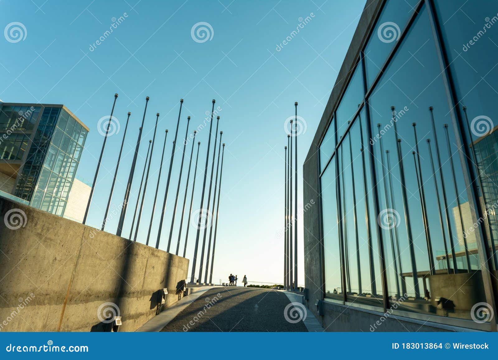 Long Columns Next To a Building Under the Blue Sky Stock Photo - Image ...