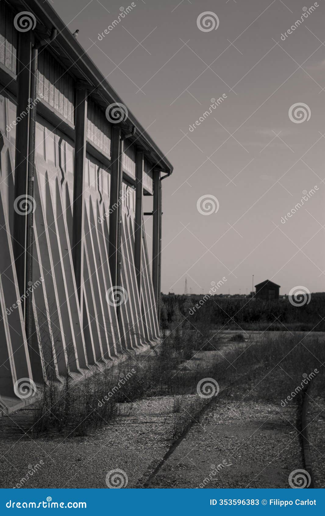 Long Concrete Wall with Triangular Supports and Abandoned Railway ...