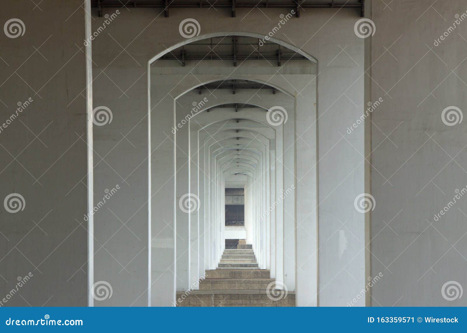 Long Corridor with Arch-shaped White Walls in an Old Building Stock ...