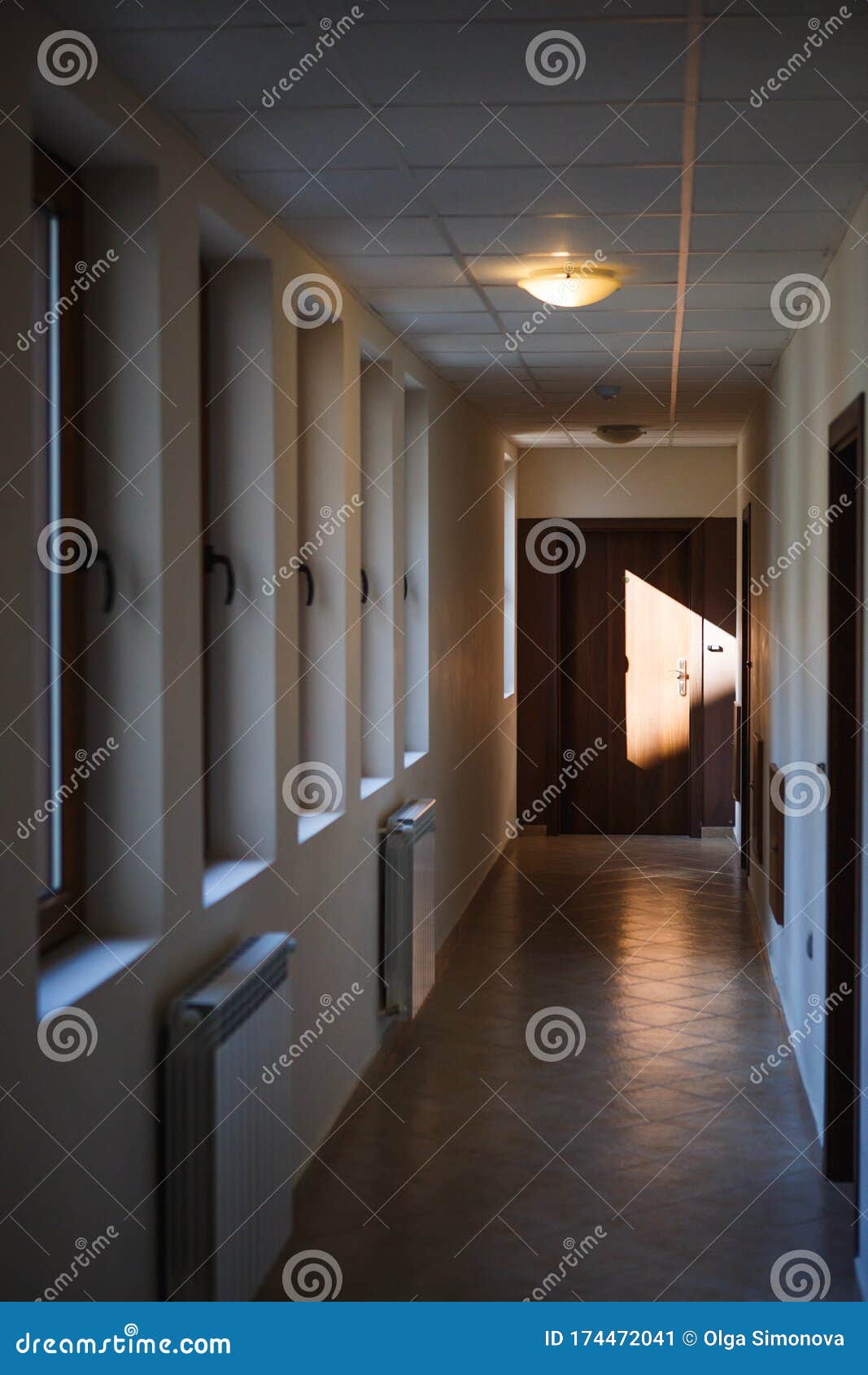 A Long Corridor in the Hotel with Windows and Doors. Stock Image ...