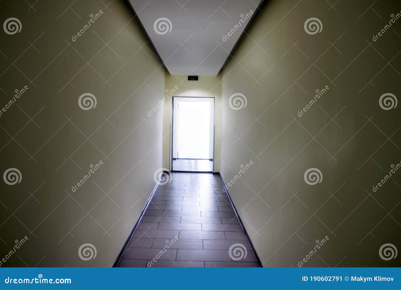 A Long Corridor with an Open Door. a Bright Light Shines from the Open ...
