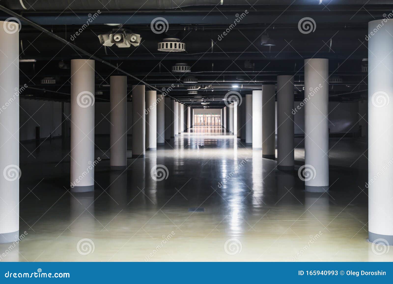 Long Corridor with Round Columns in the Basement Stock Image - Image of ...