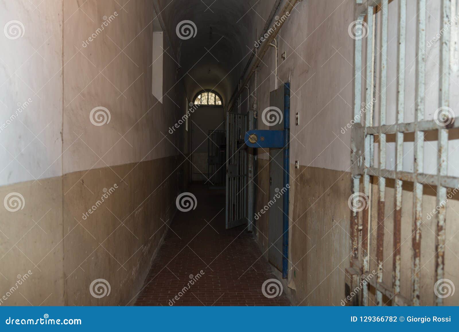 Long Corridor and White and Worn Walls of a Prison Stock Photo - Image ...