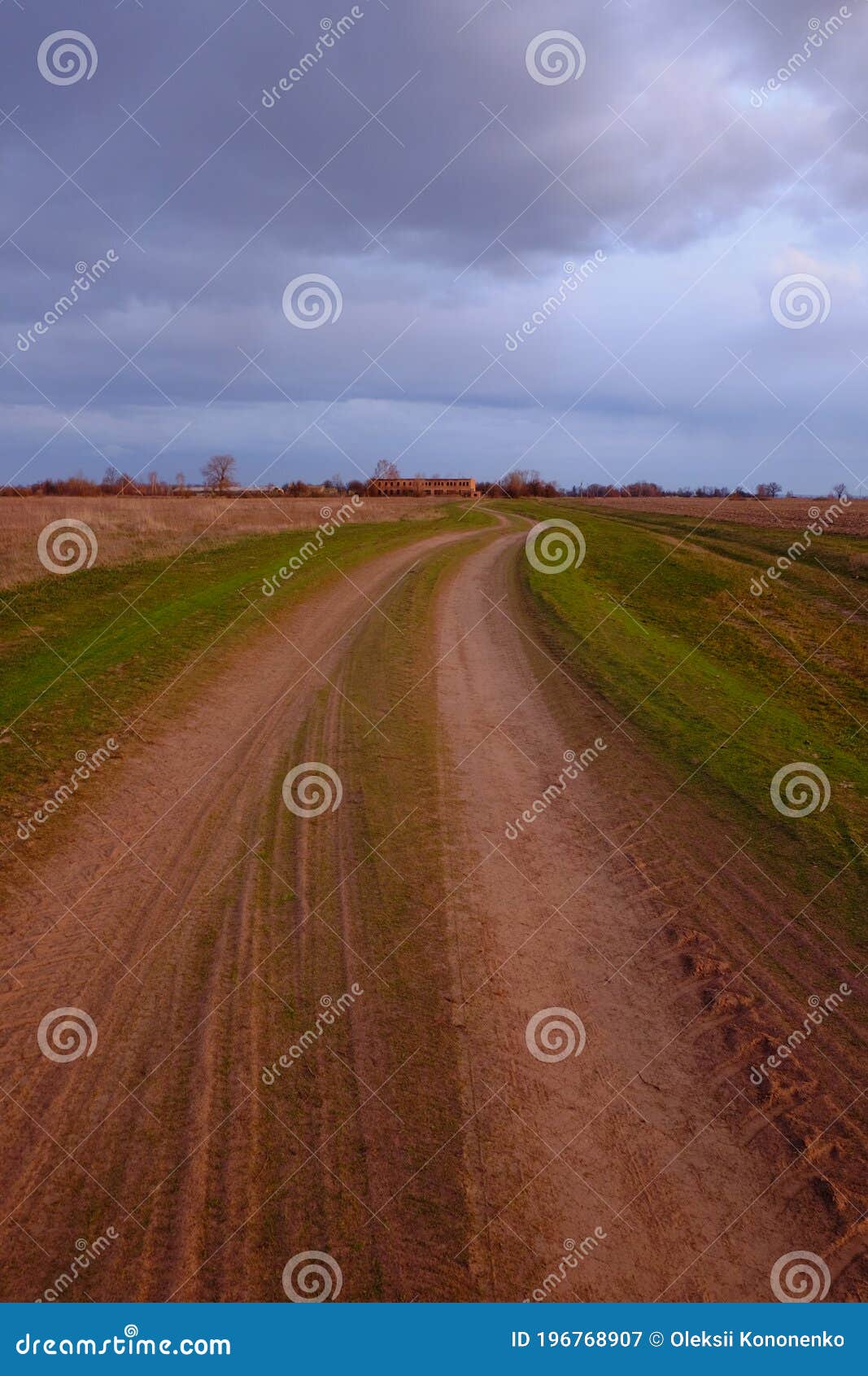 Long Dirt Road in the Fields. Cloudy Evening Landscape Stock Image ...