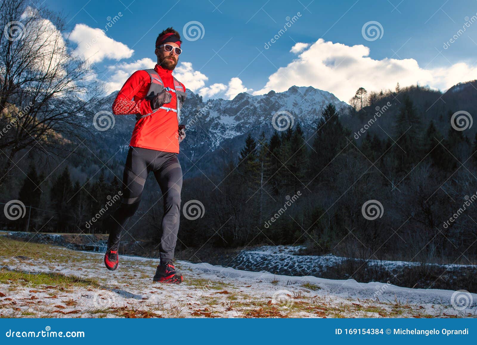 Long Distance Runner in the Mountains during a Winter Training Stock ...