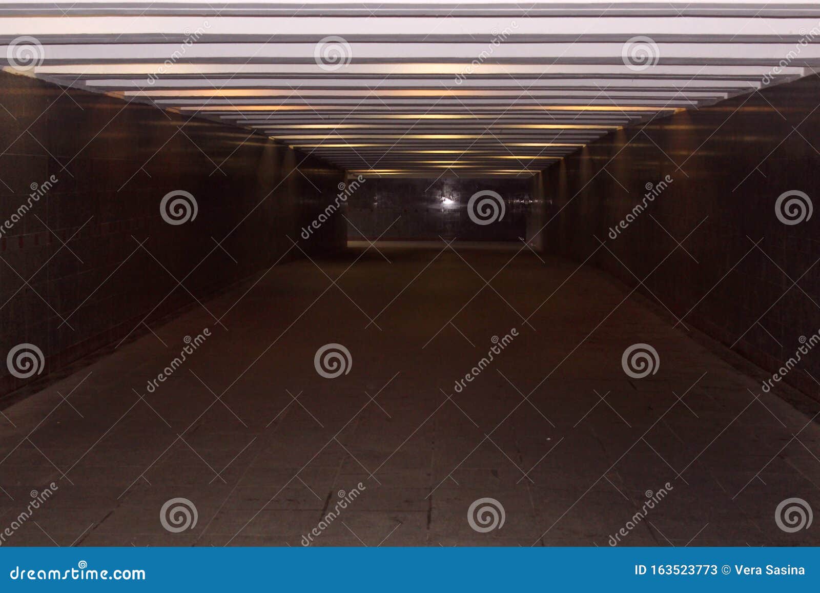 A Long Empty Dark Rectangular Tunnel with Lanterns in the City ...