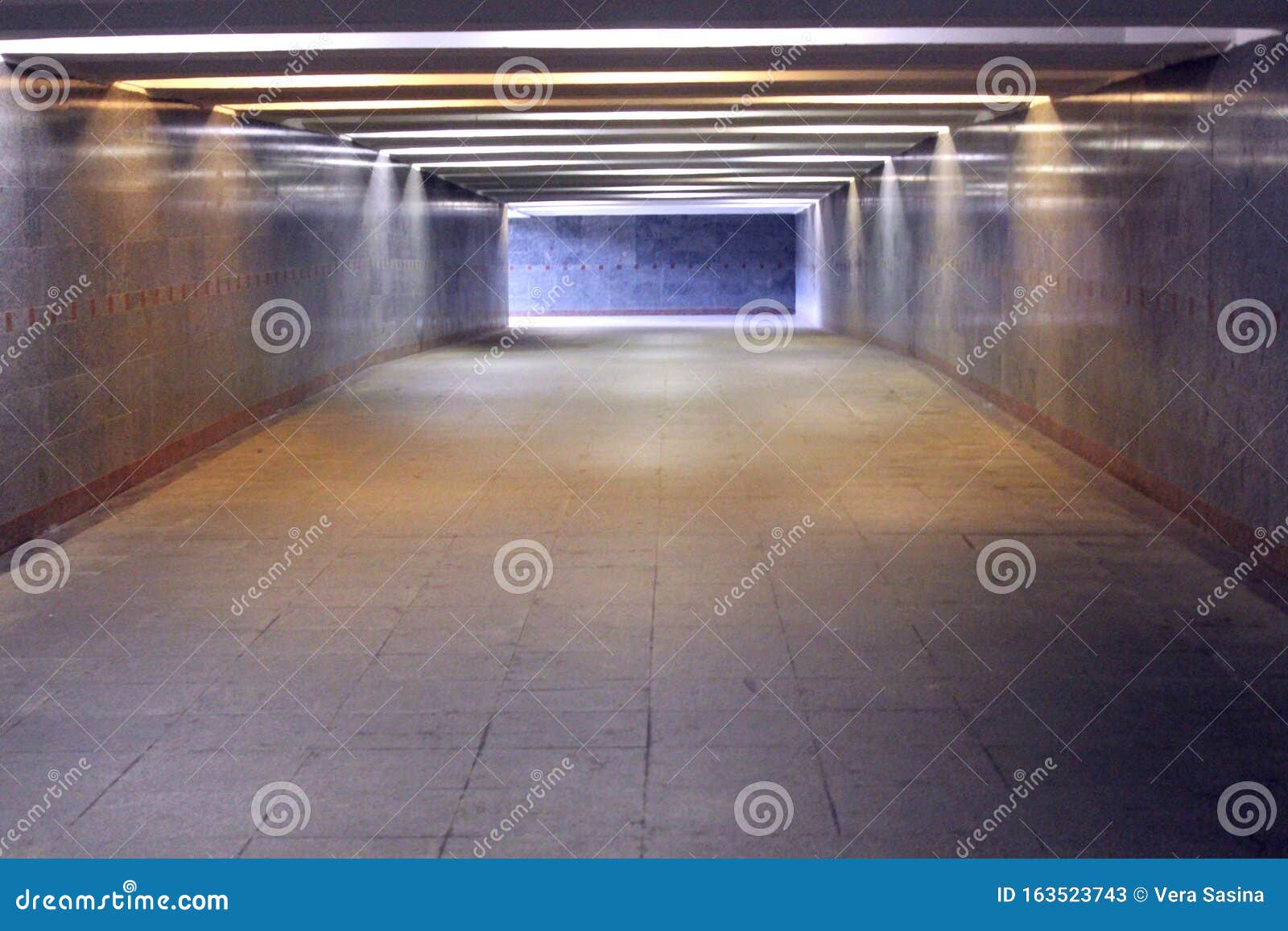 A Long Empty Rectangular Tunnel with Lanterns in the City Underground ...