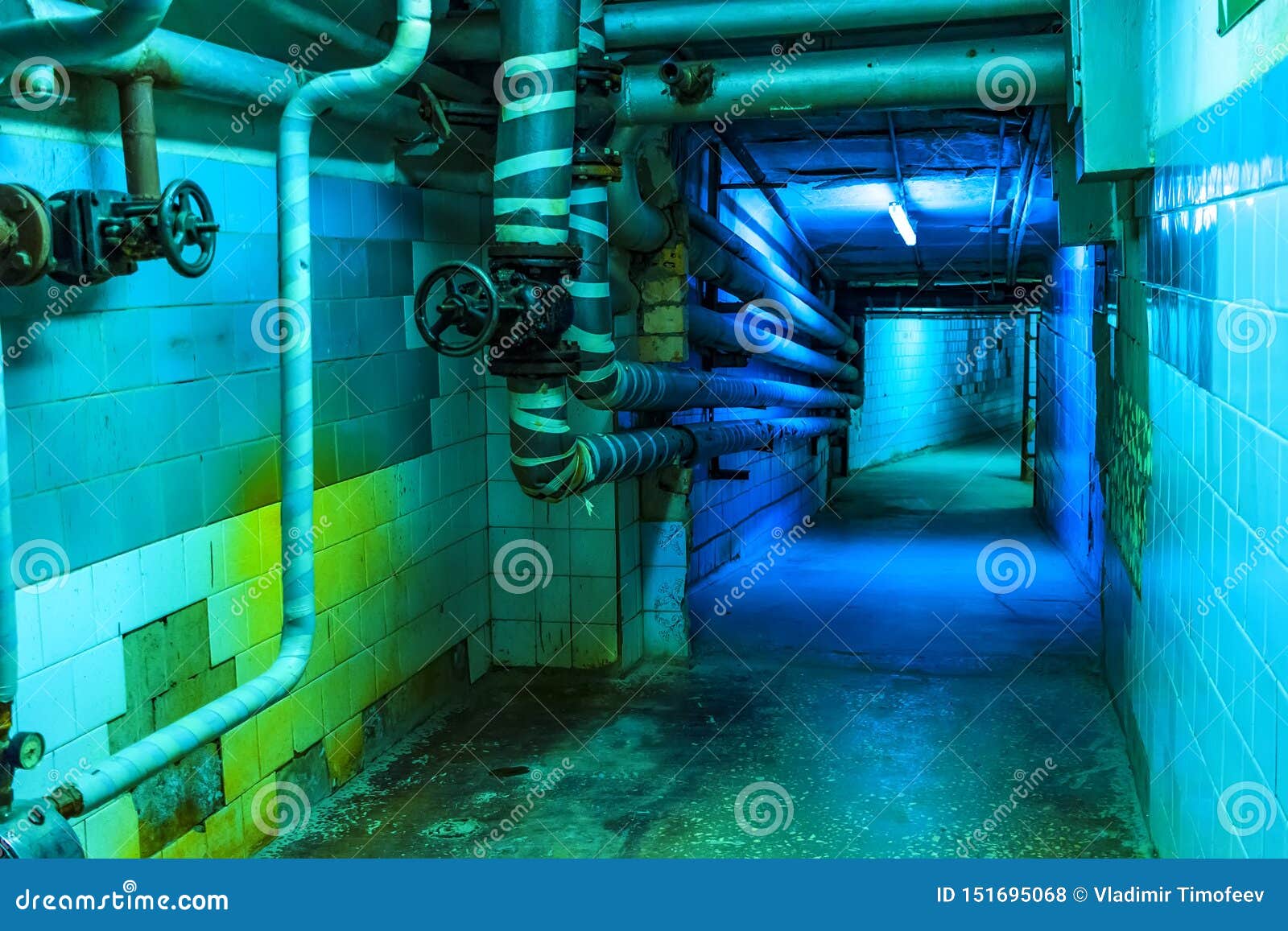 Long Empty Tunnel with Pipes and Utilities on Ceiling, Blue Neon Lights ...
