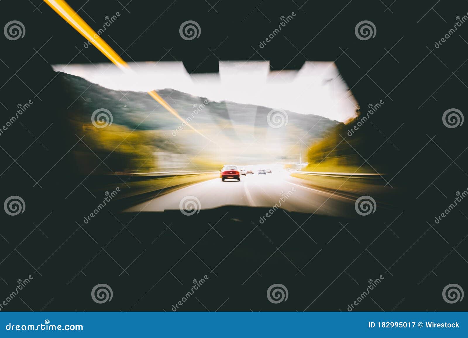 Long Exposure of the Cars Going Out of a Tunnel on a Highway Surrounded ...
