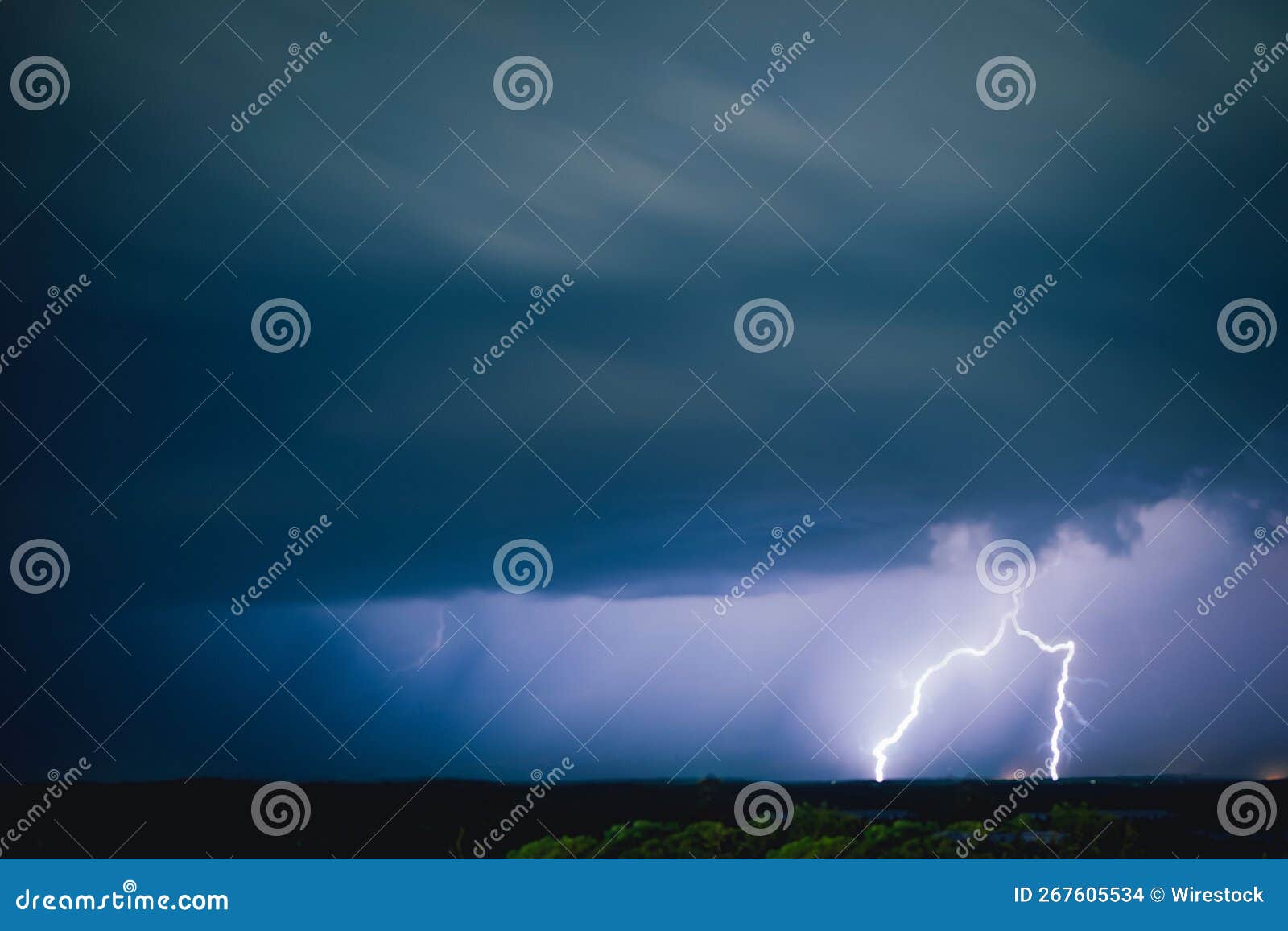 Long Exposure of Dramatic Clouds in the Sky and Lightning Illuminating ...