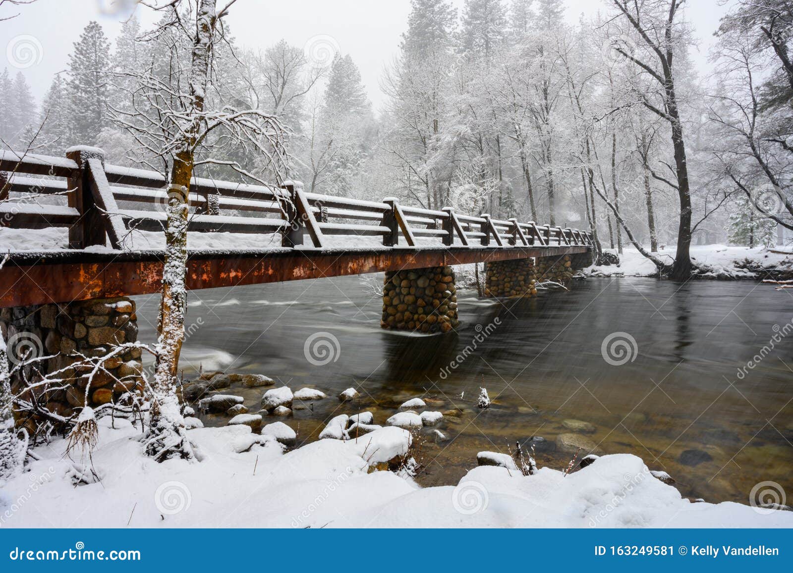 Long Exposure of Driving Snow and Bridge Over the Merced River Stock ...