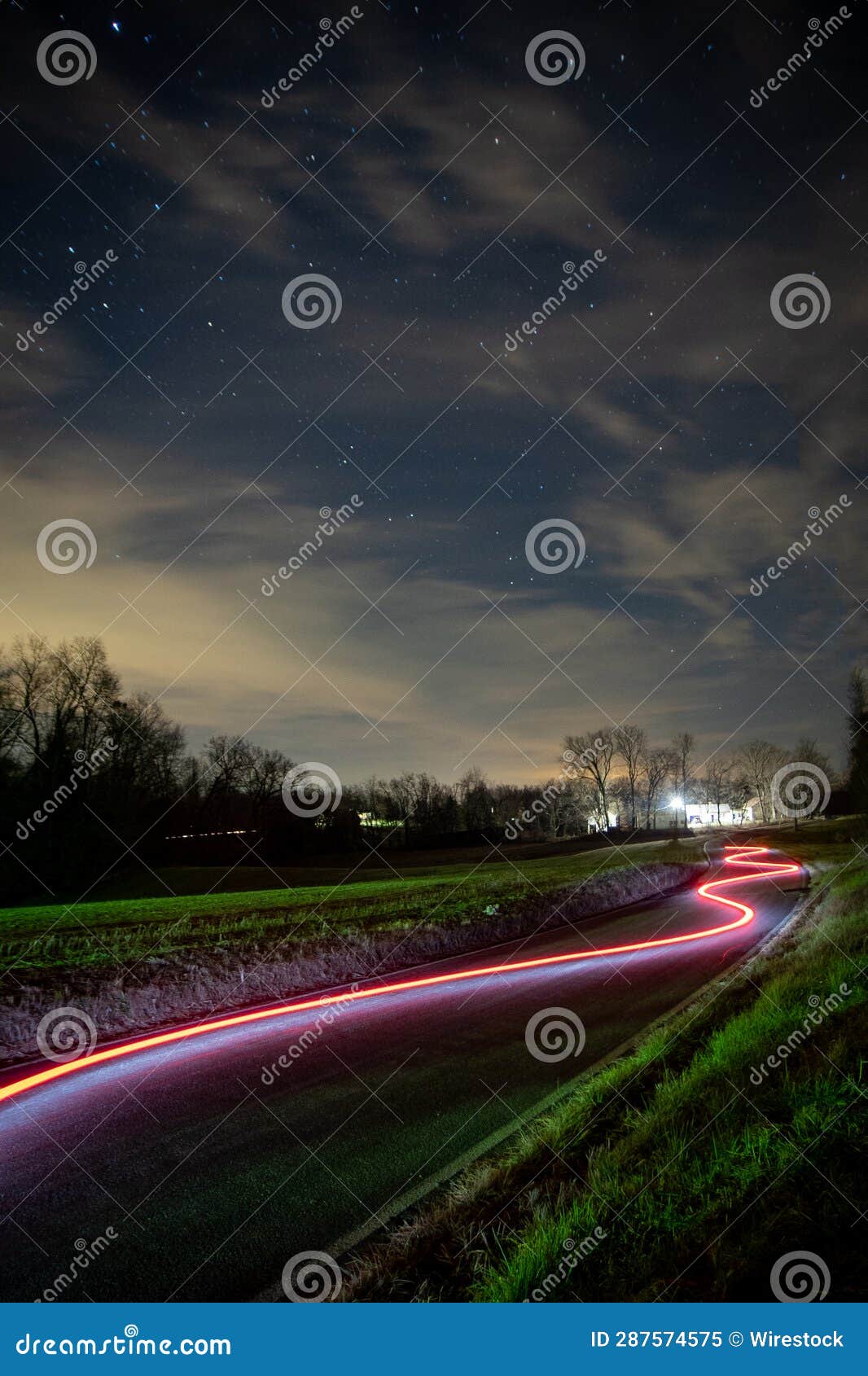 Long Exposure of Red Light on the Road with a Starry Night Sky ...