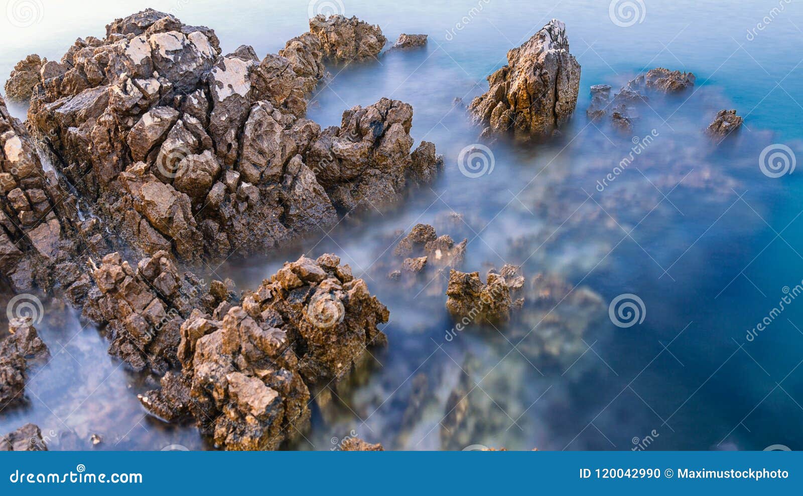 Long Exposure of Sea Rocks during Sunset Stock Photo - Image of ...