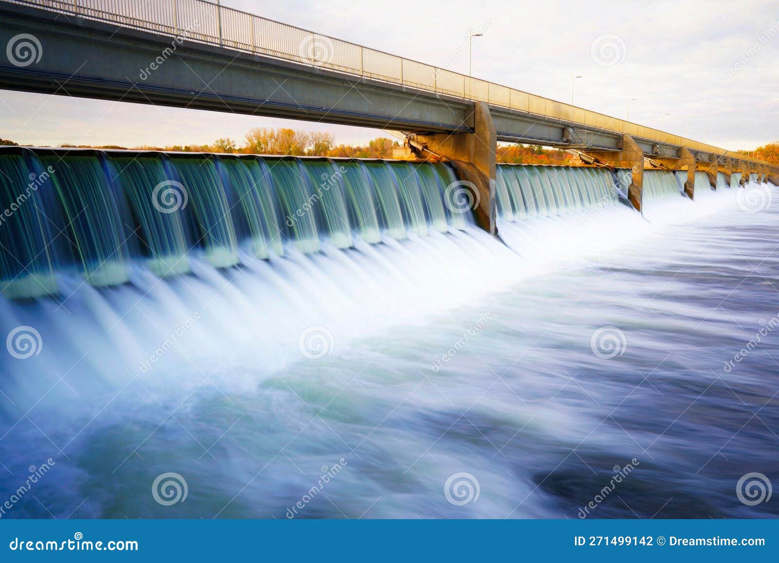 Long Exposure Shot of a Long Bridge with Rushing Water Cascading from ...
