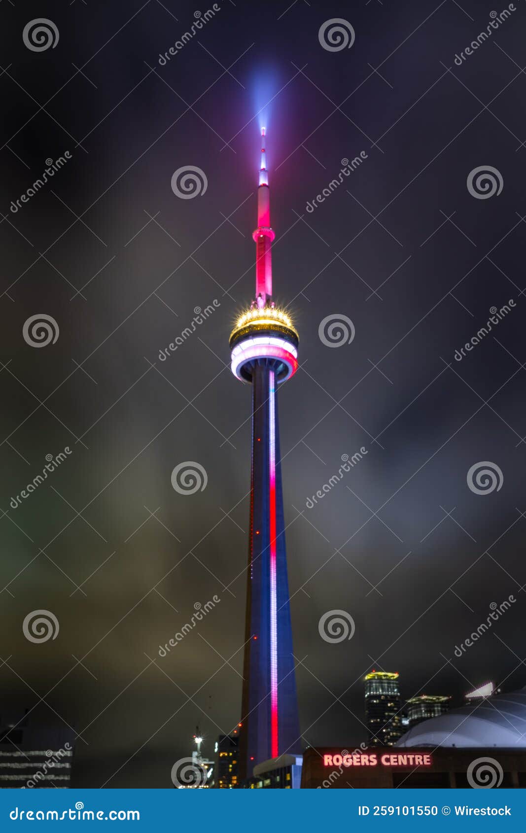 Long Exposure Shot of the CN Tower in Toronto at Night Under Clouds ...