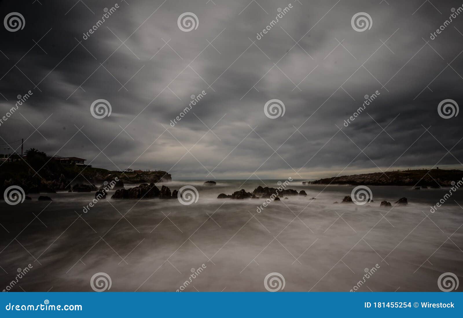 Long Exposure Shot of the Seaside Surrounded by Cliffs and Numerous ...