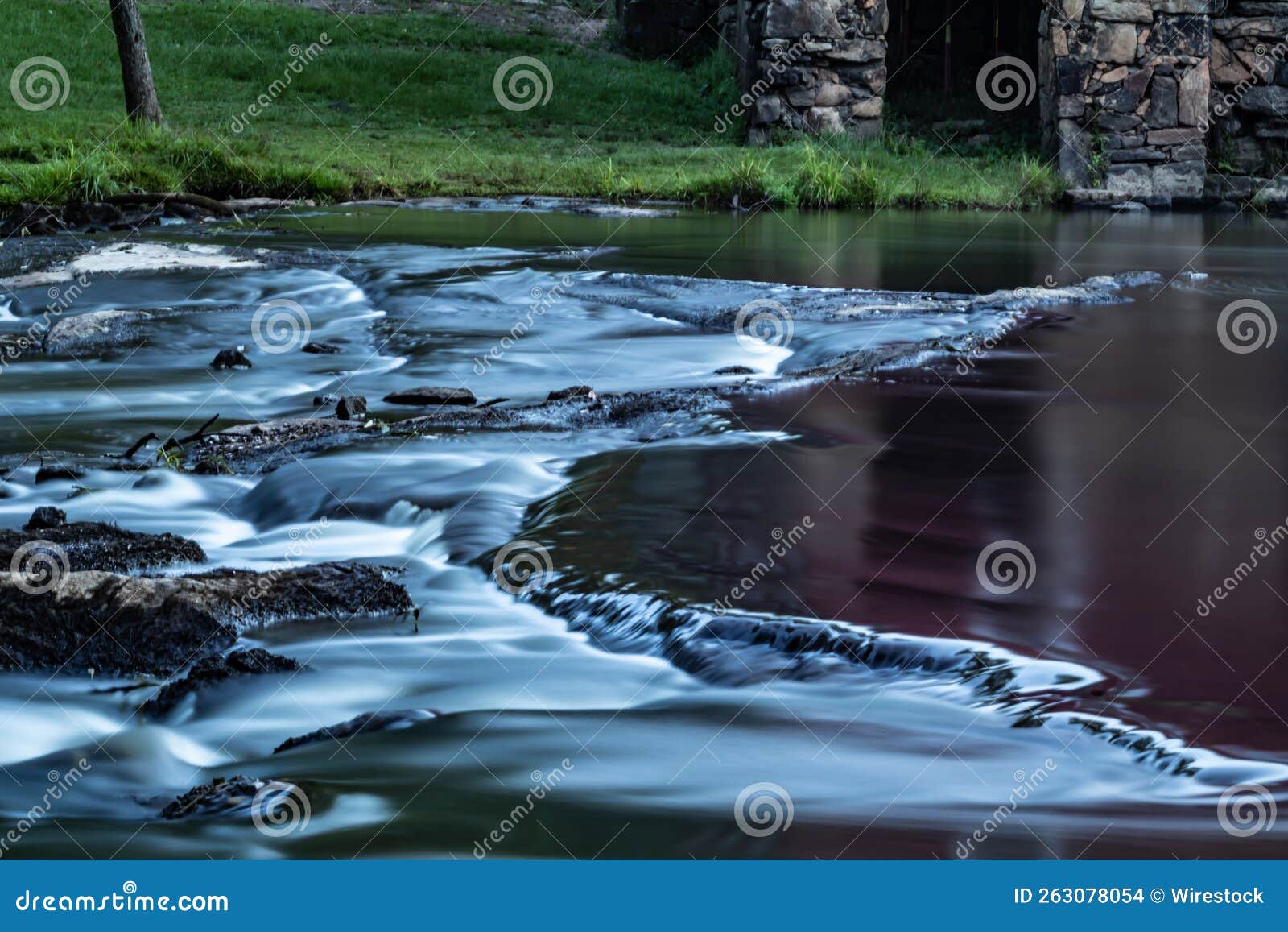 Long Exposure Shot of a Small River with Smooth Flowing Water in the ...