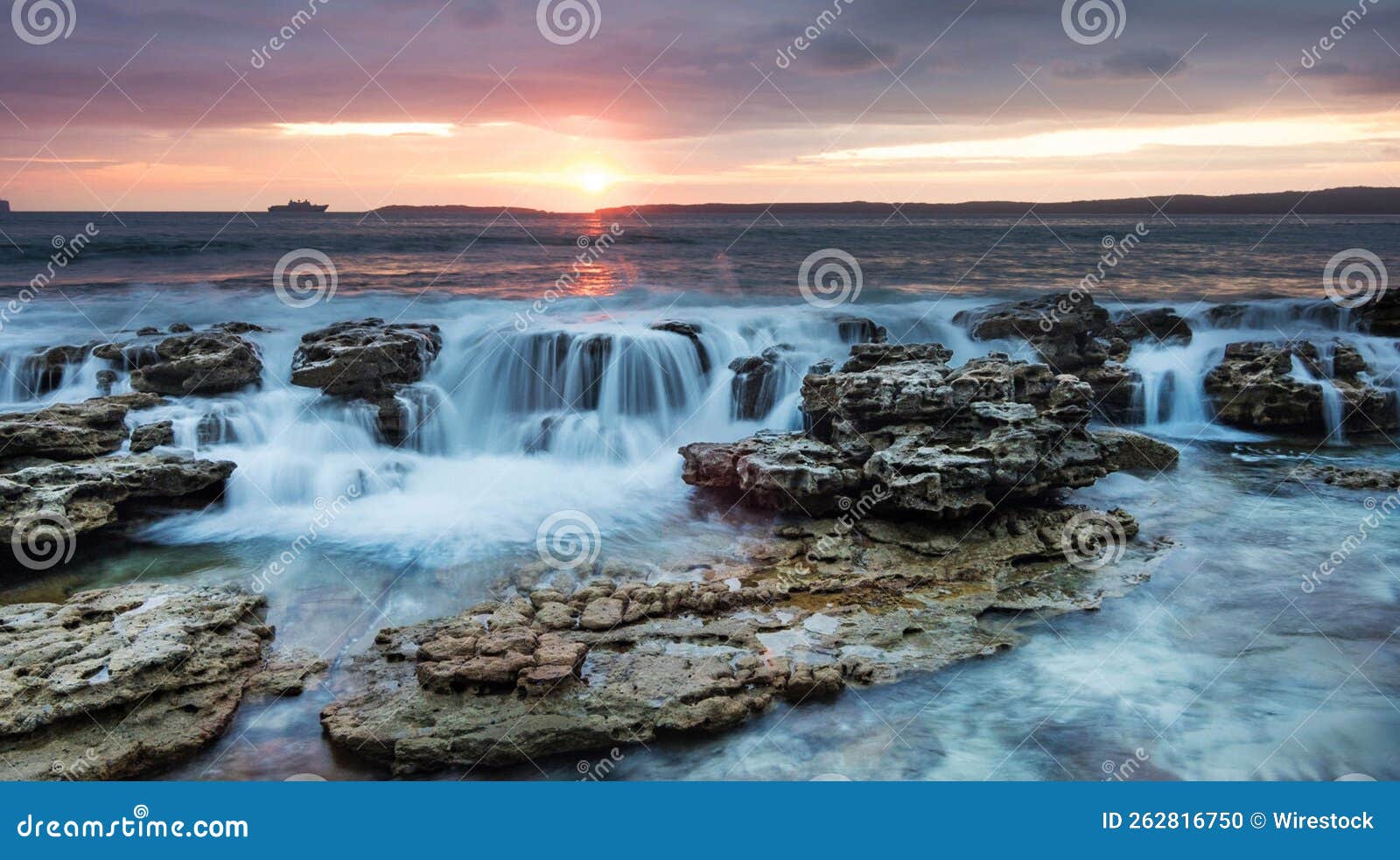 Long Exposure Shot of a Small Waterfall at Sunset Stock Photo - Image ...