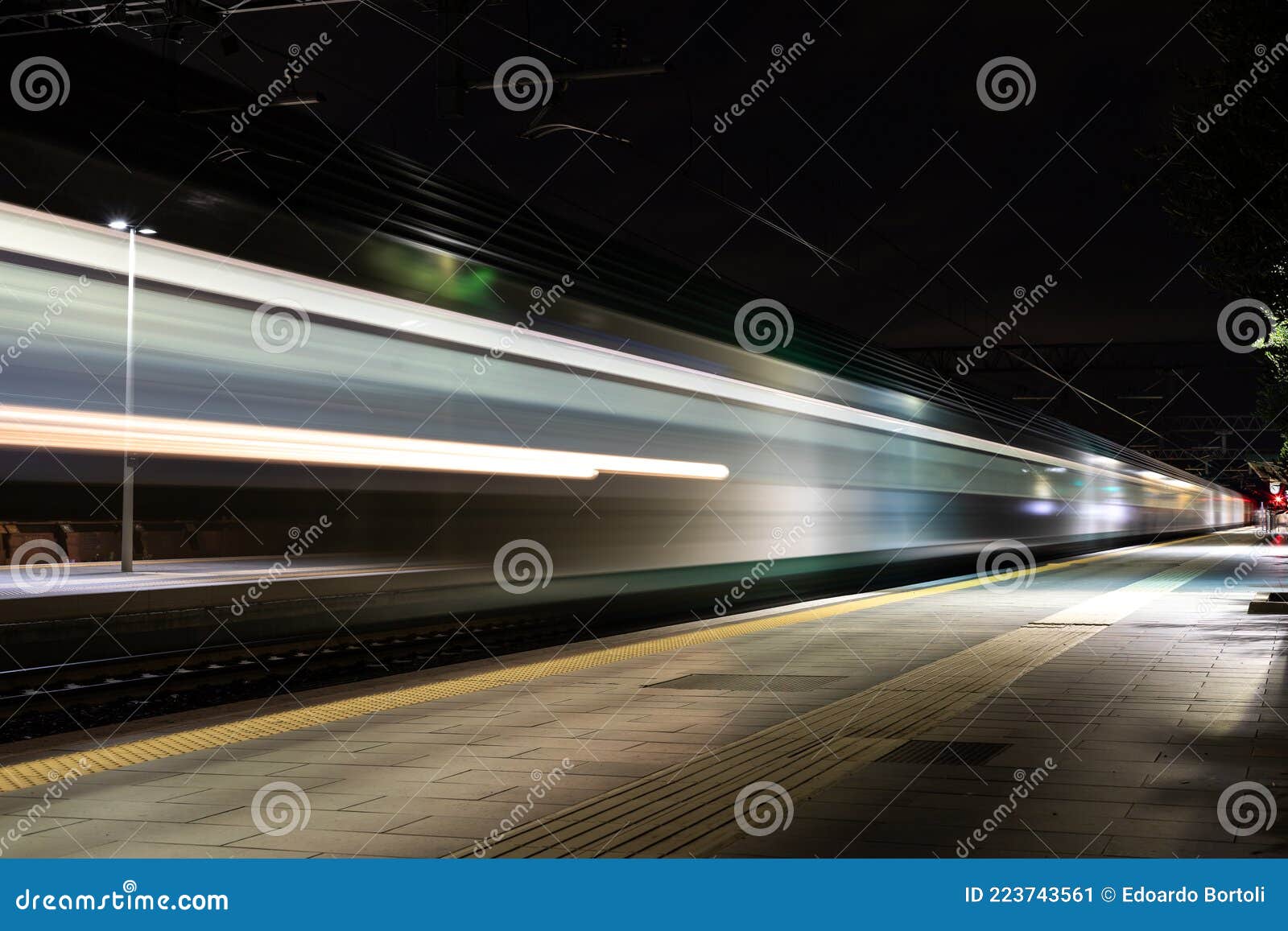 Long Exposure Train Running through the Station at Night Editorial ...