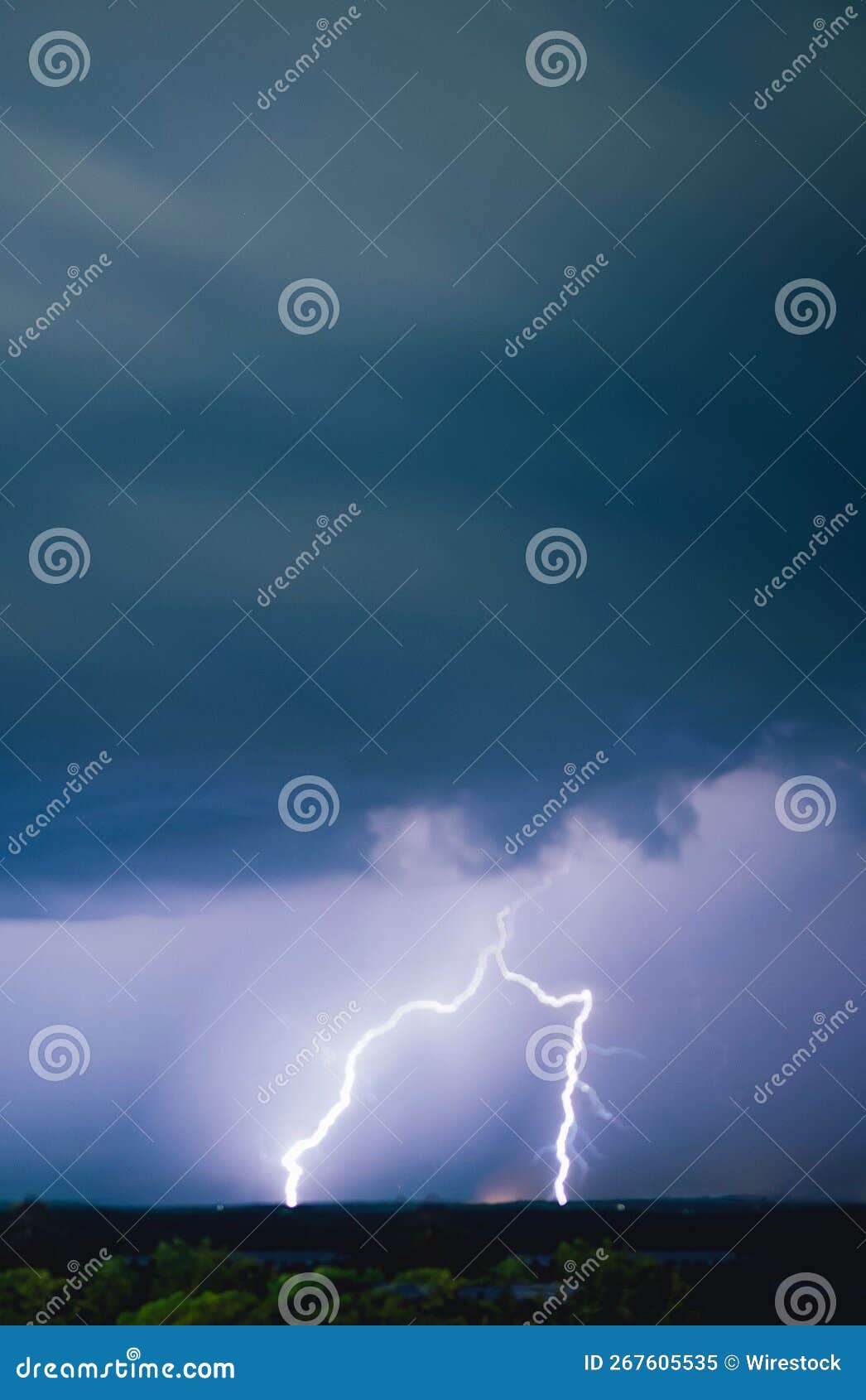 Long Exposure Vertical Shot of Dramatic Clouds in the Sky and Lightning ...