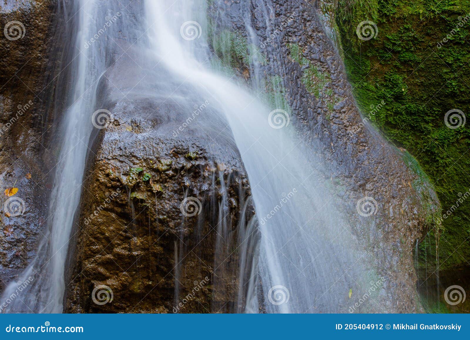 Long Exposure Waterfall Over Brown and Green Rocks Stock Photo - Image ...