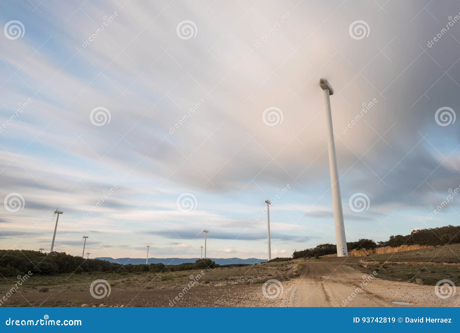 Long Exposure of a Windmill Rotating at Dusk Stock Image - Image of ...