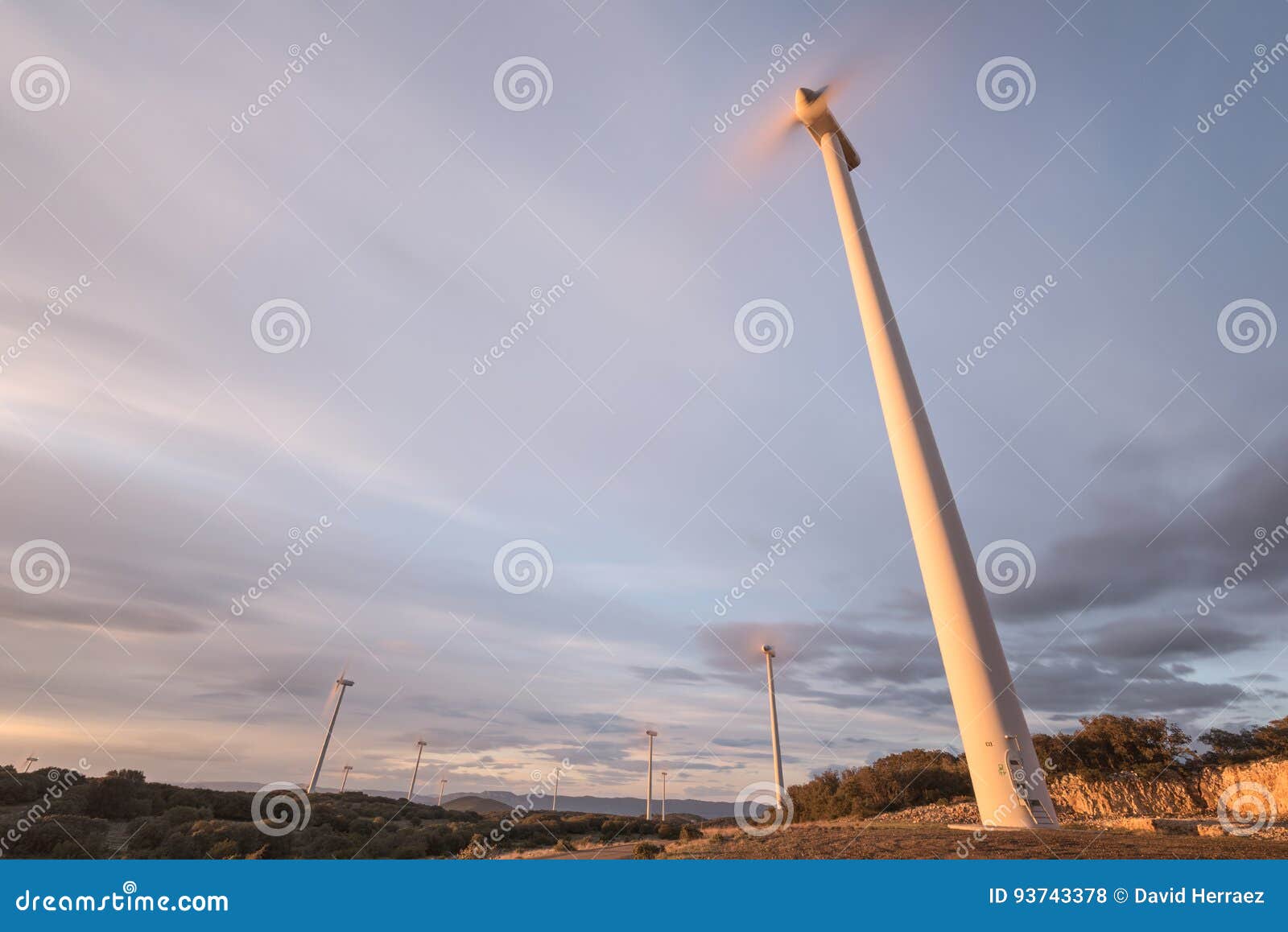 Long Exposure of a Windmill Rotating at Dusk Stock Photo - Image of ...
