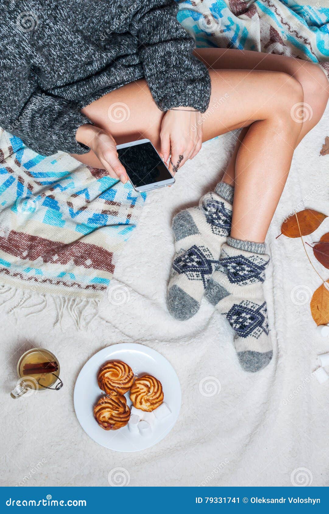 Long Female Feet in Warm Woolen Socks with Smartphone Stock Image ...