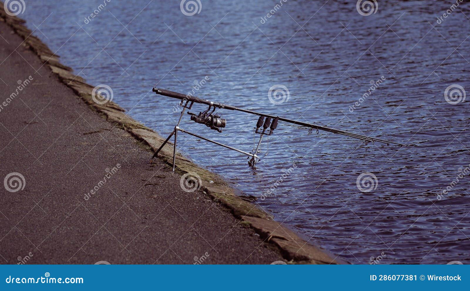 Long Fishing Rod on a Riverbank. Stock Image - Image of outdoor ...