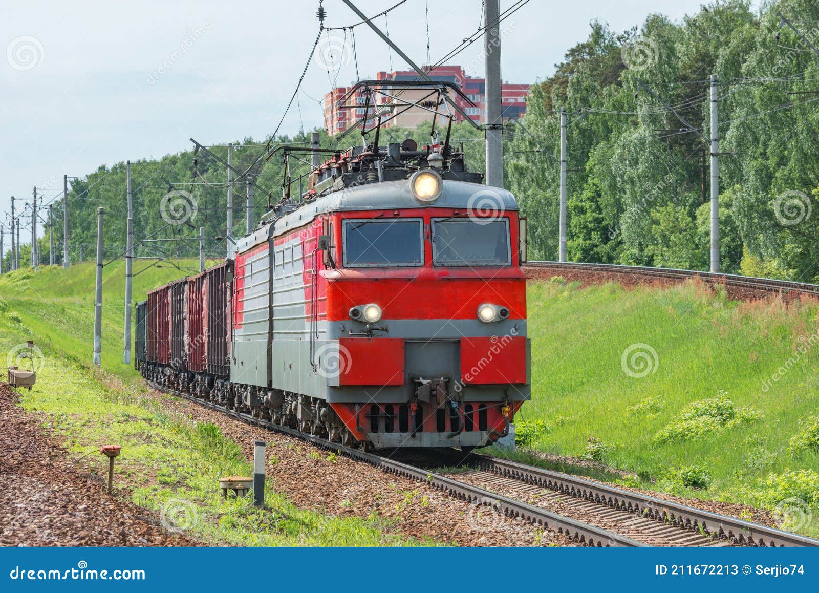 Long Freight Train Approaches Stock Image - Image of approach, cargo ...