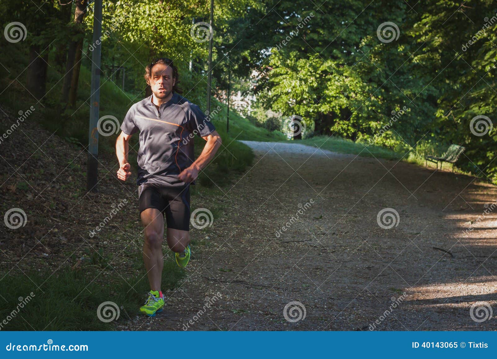 Long Haired Athlete Running in a City Park Stock Image - Image of ...