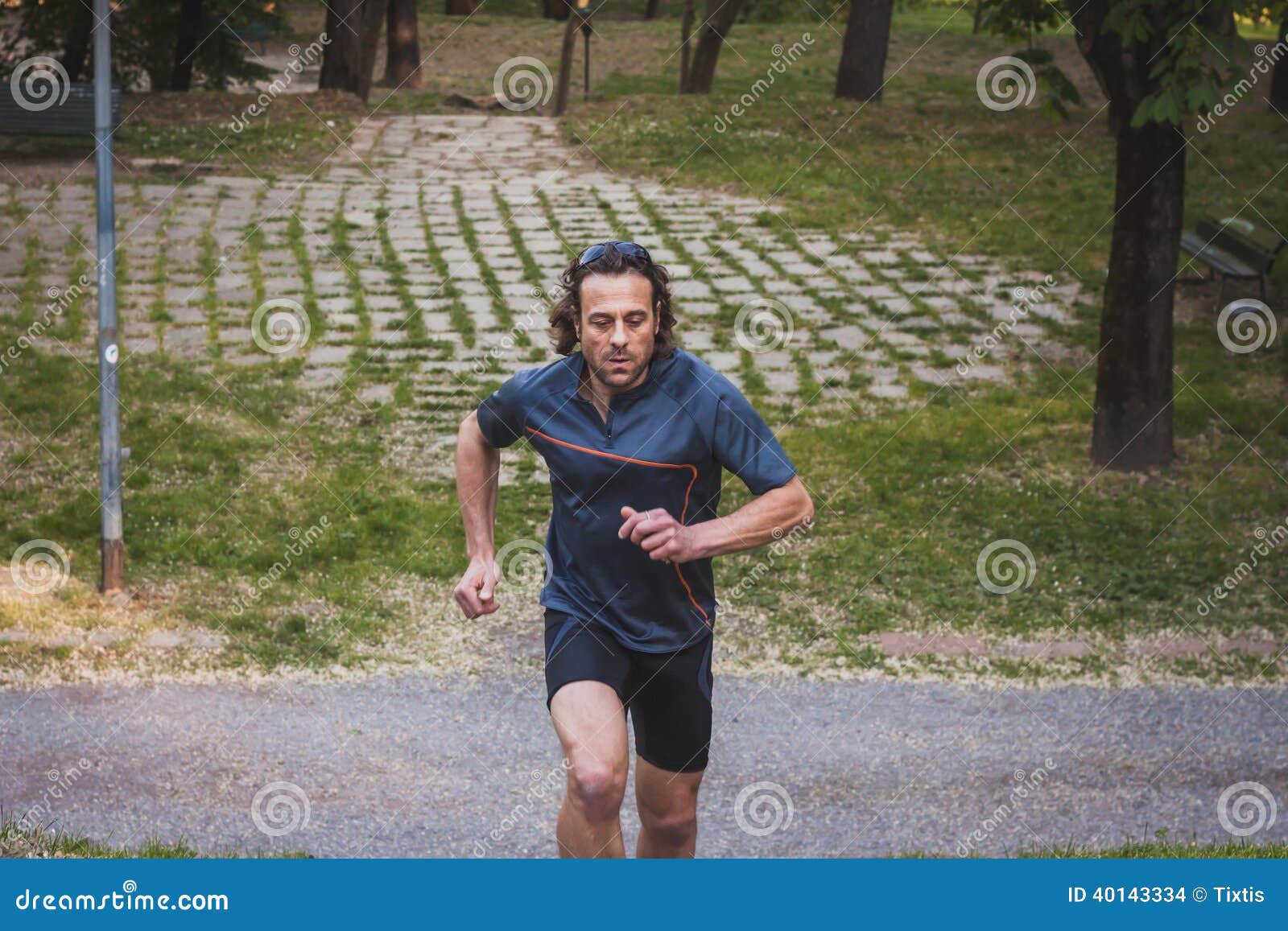 Long Haired Athlete Running in a City Park Stock Photo - Image of ...