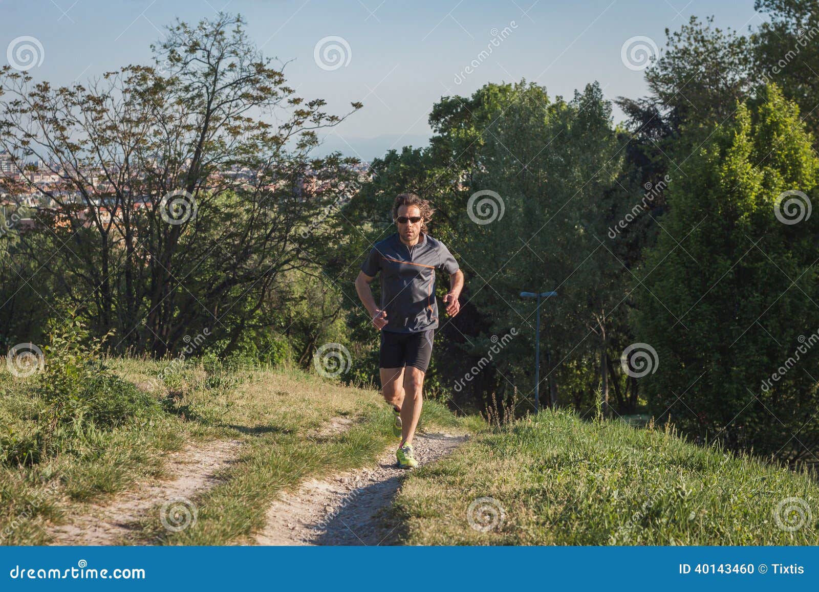 Long Haired Athlete Running in a City Park Stock Photo - Image of hair ...