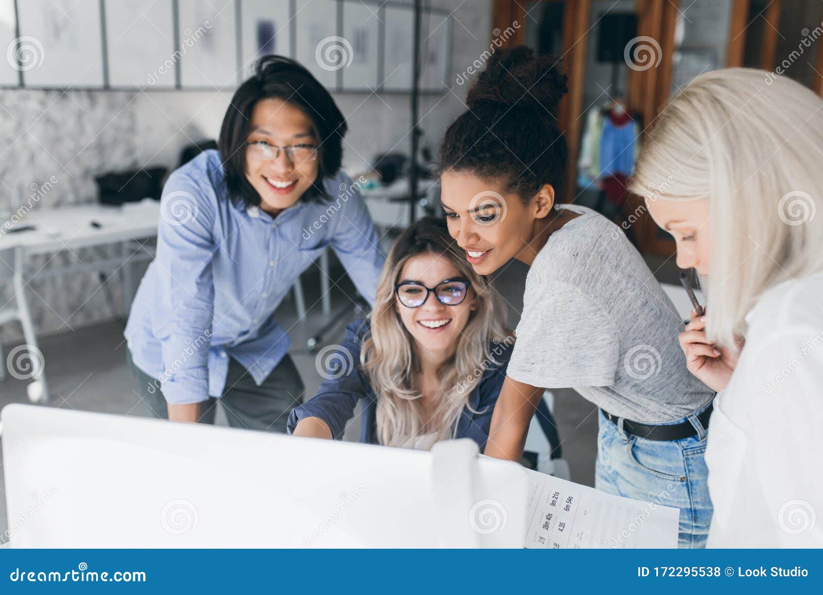 Asian Programmer Woman Pointing And Looking On Multiple Laptop Screen ... Asian Programmer Woman Pointing And Looking On Multiple Laptop Screen ...