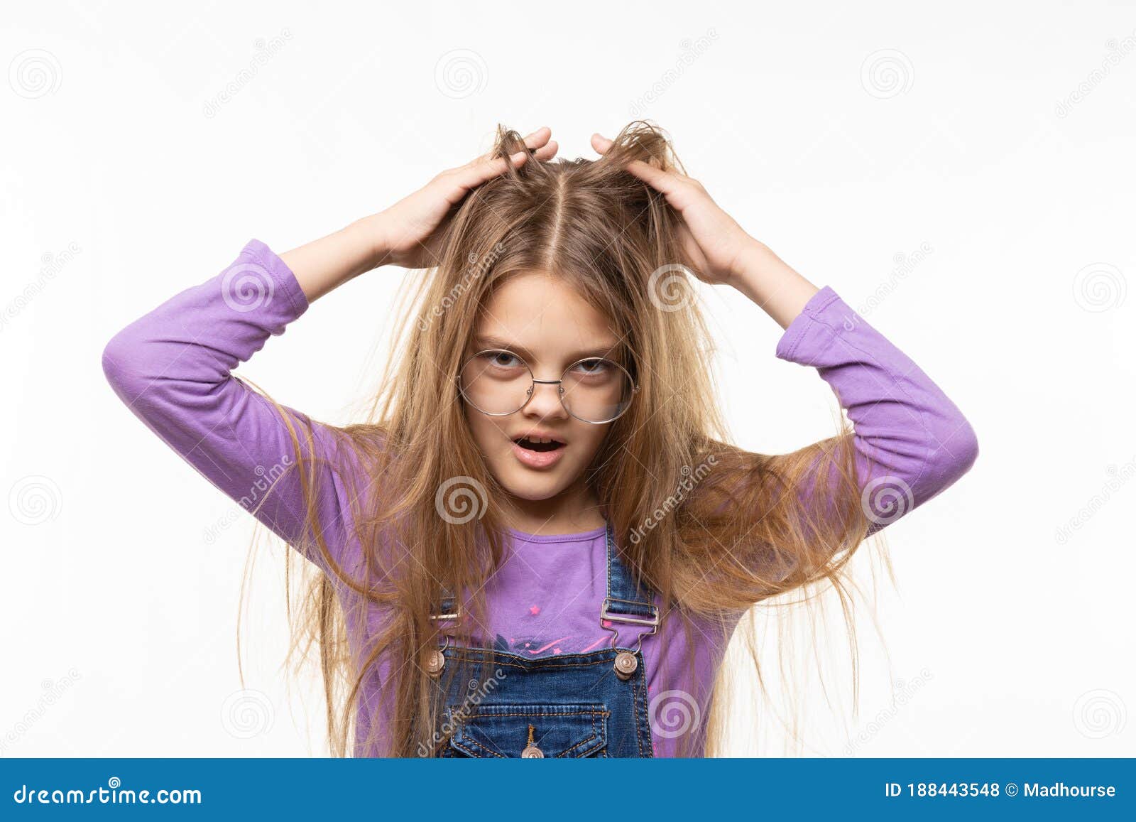Long-haired Girl Scratches Her Head with Her Hands Stock Photo - Image ...