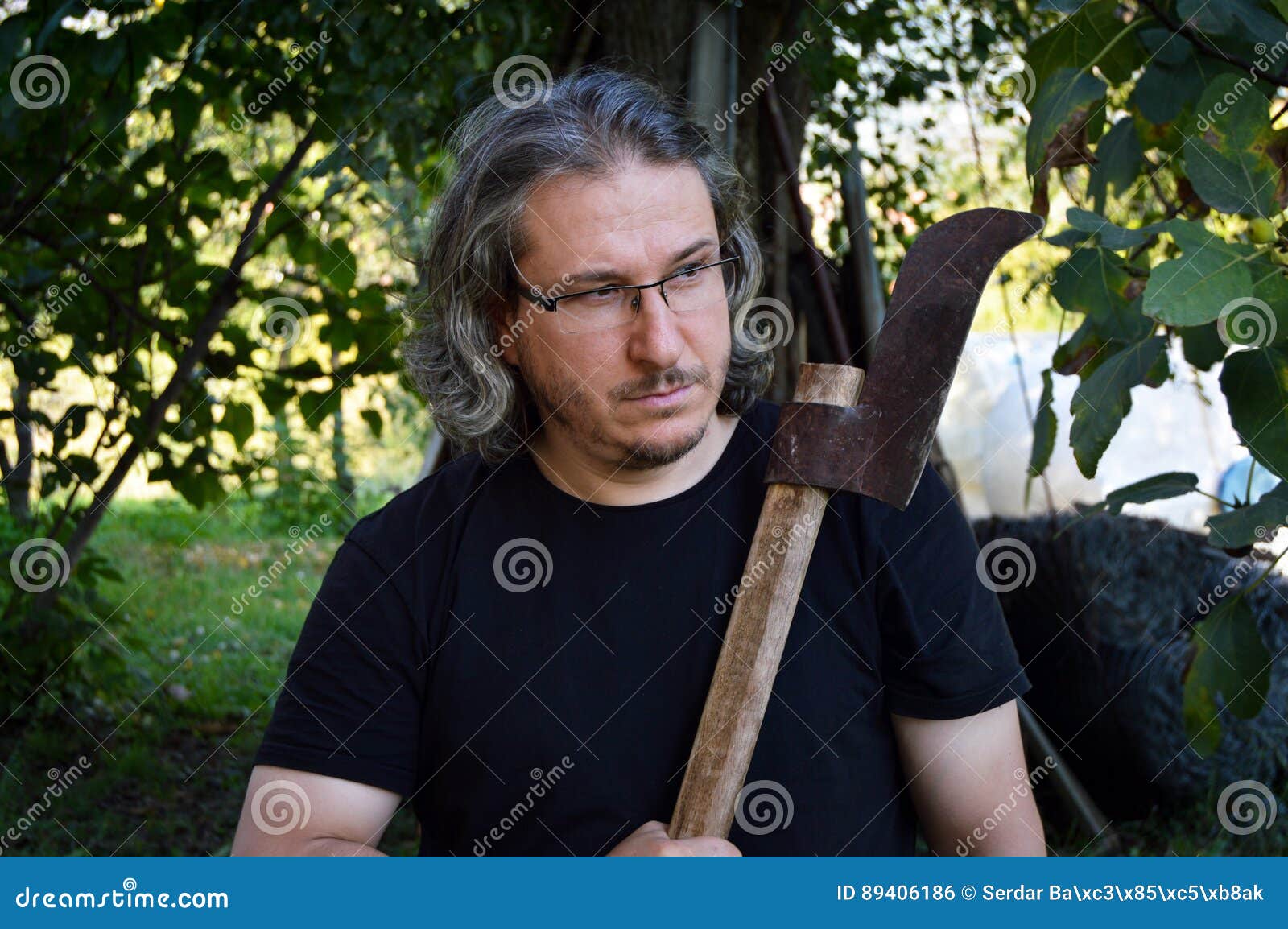 Long haired man with ax stock photo. Image of frowning - 89406186