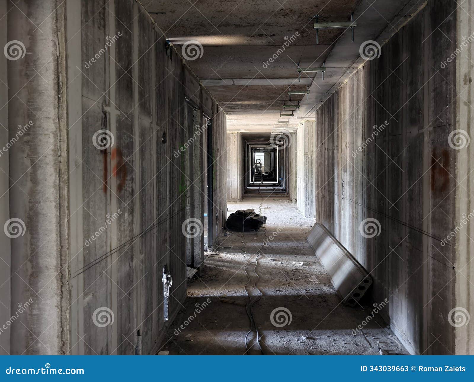 A Long Hallway Featuring Sturdy Concrete Walls and Floor Stock Image ...