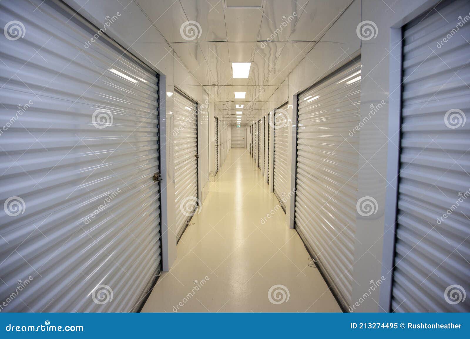 Long Hallway of a Self Storage Unit Stock Image - Image of moving ...