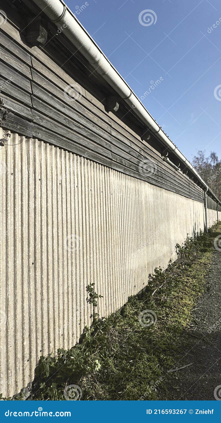 Long High Ugly Wall with a Rain Gutter, Which Converges at the End of ...