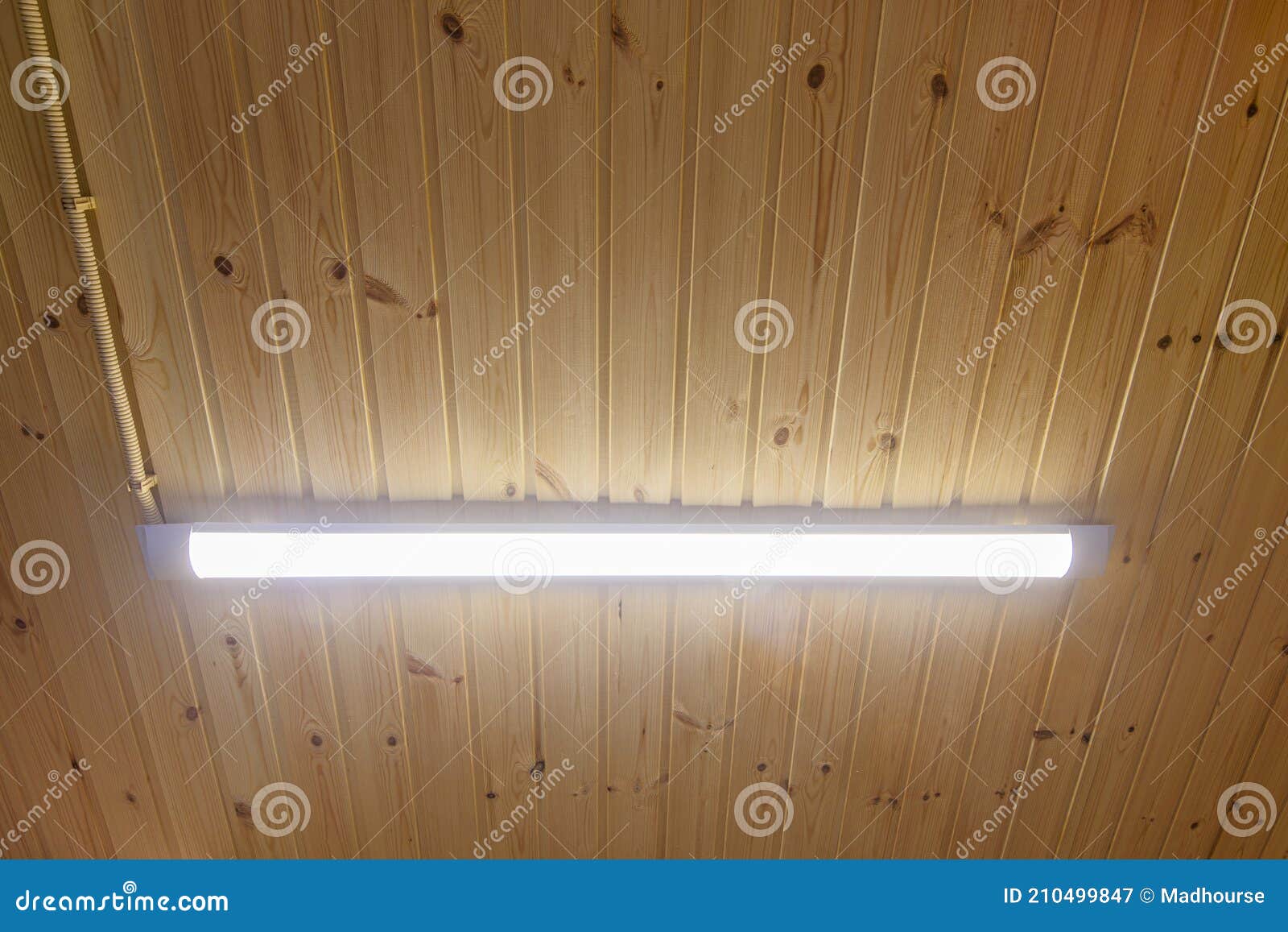 Long LED Lamp on Wood Paneling Ceiling Stock Image - Image of wooden ...