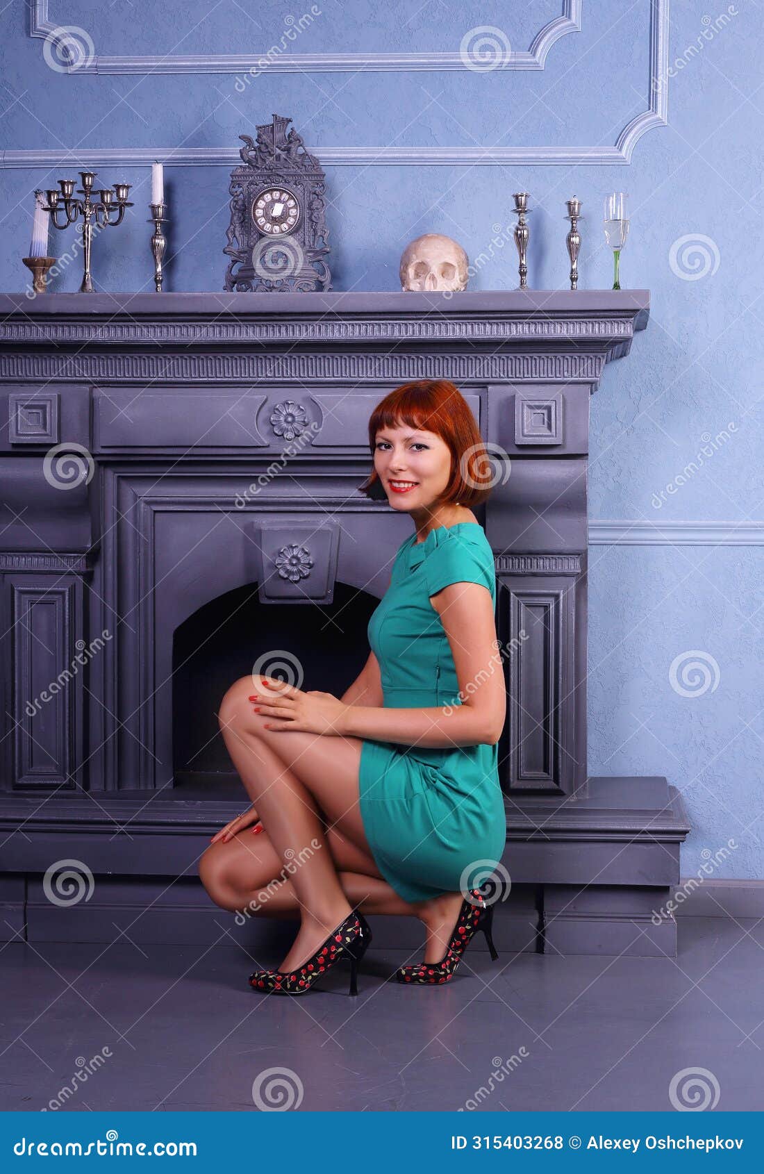 Long Legged Redhead Girl In Shiny Pantyhose And Green Minidress Posing