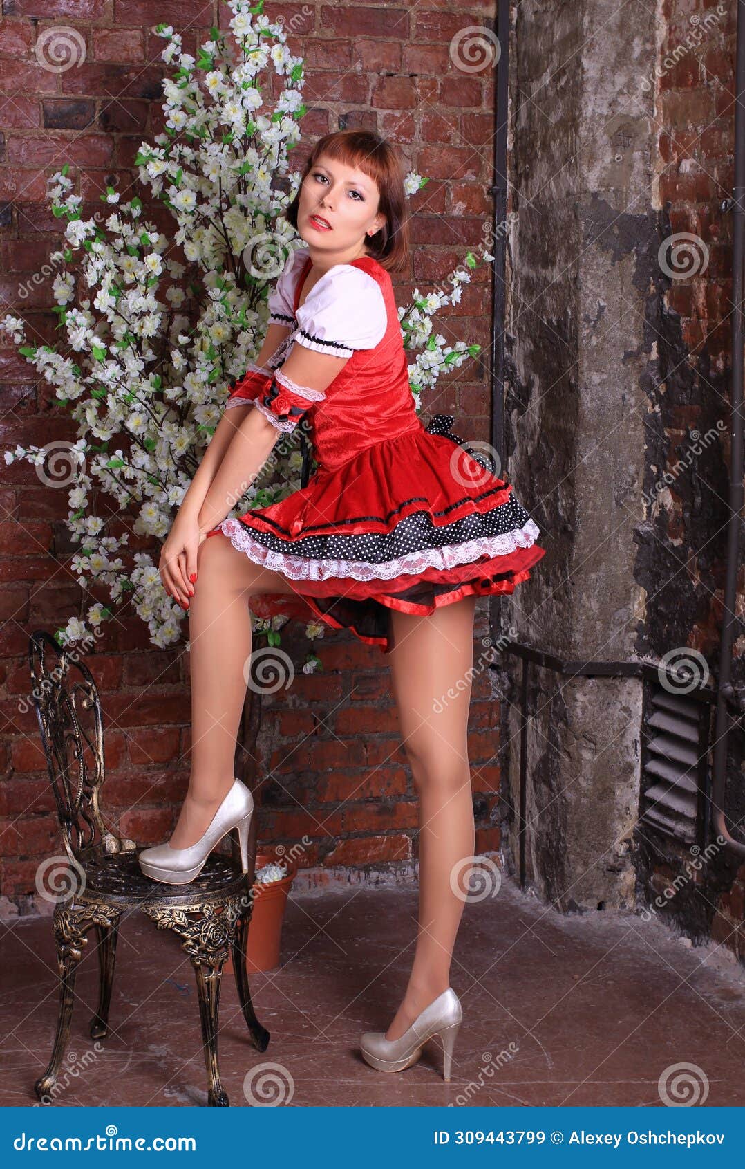 Long Legged Redhead Girl In Shiny Pantyhose And Red Minidress Posing At