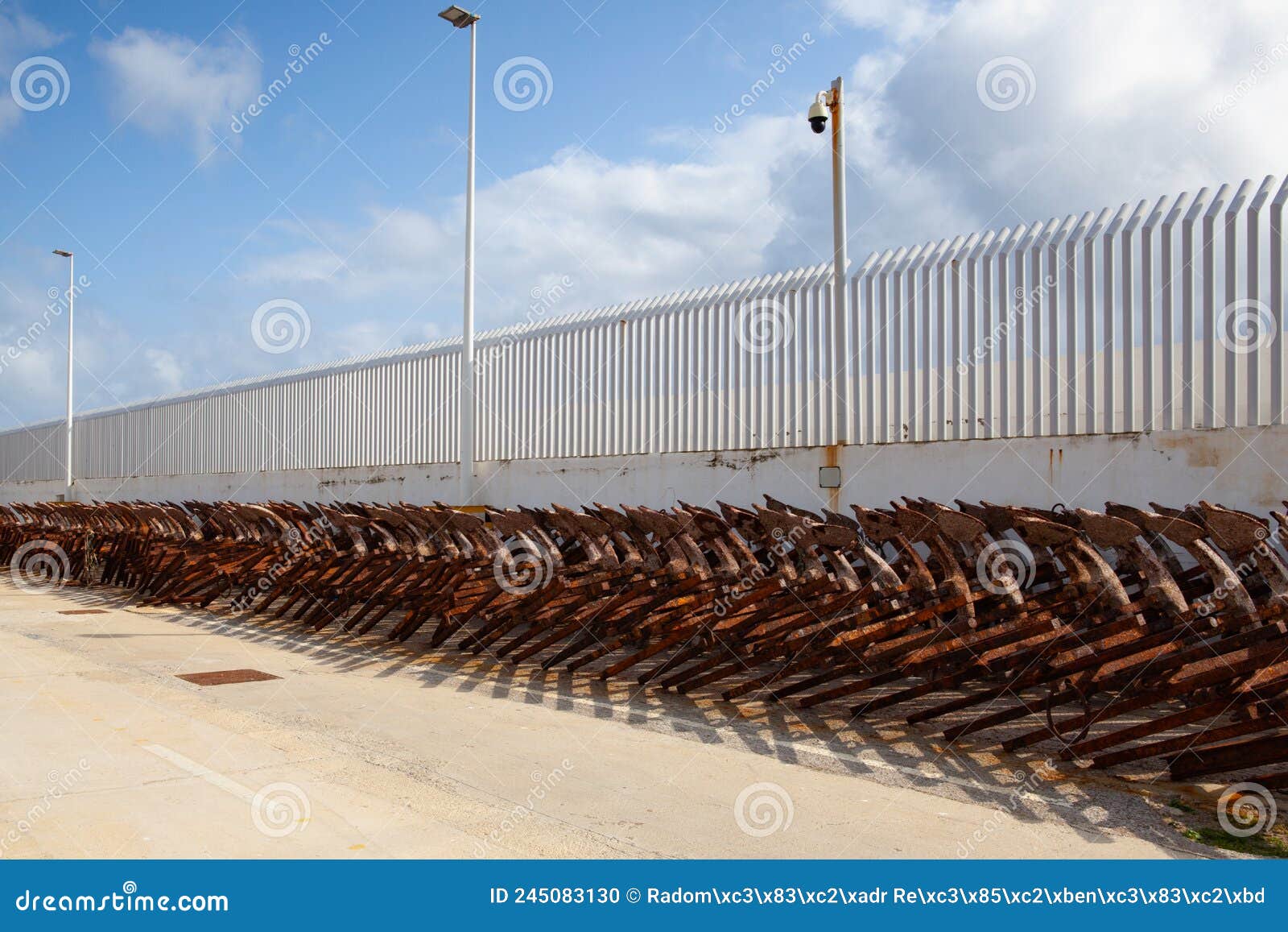 A Long Line of Discarded and Rusty Anchors Stock Photo - Image of long ...