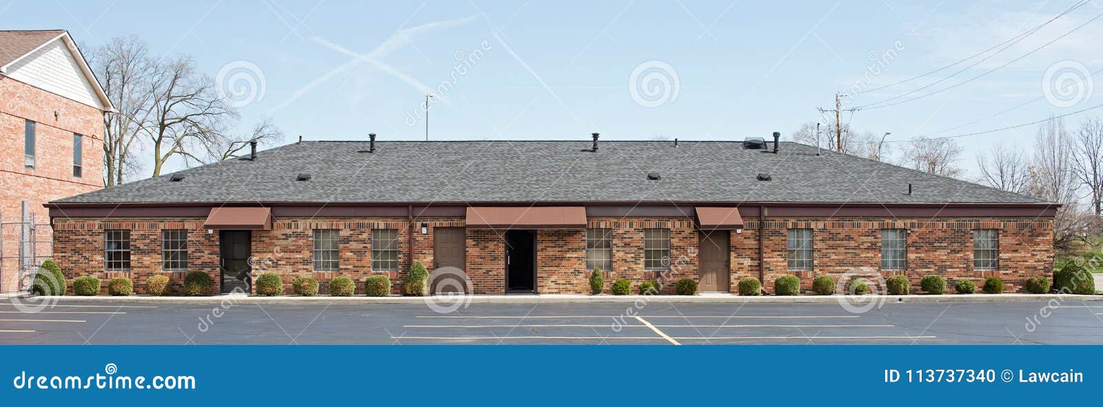 Long, Patchwork Brick Building Stock Photo - Image of outdoors ...